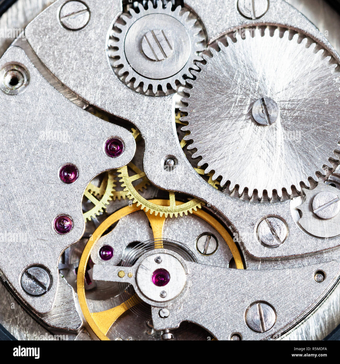 gears of mechanical clockwork close up Stock Photo - Alamy