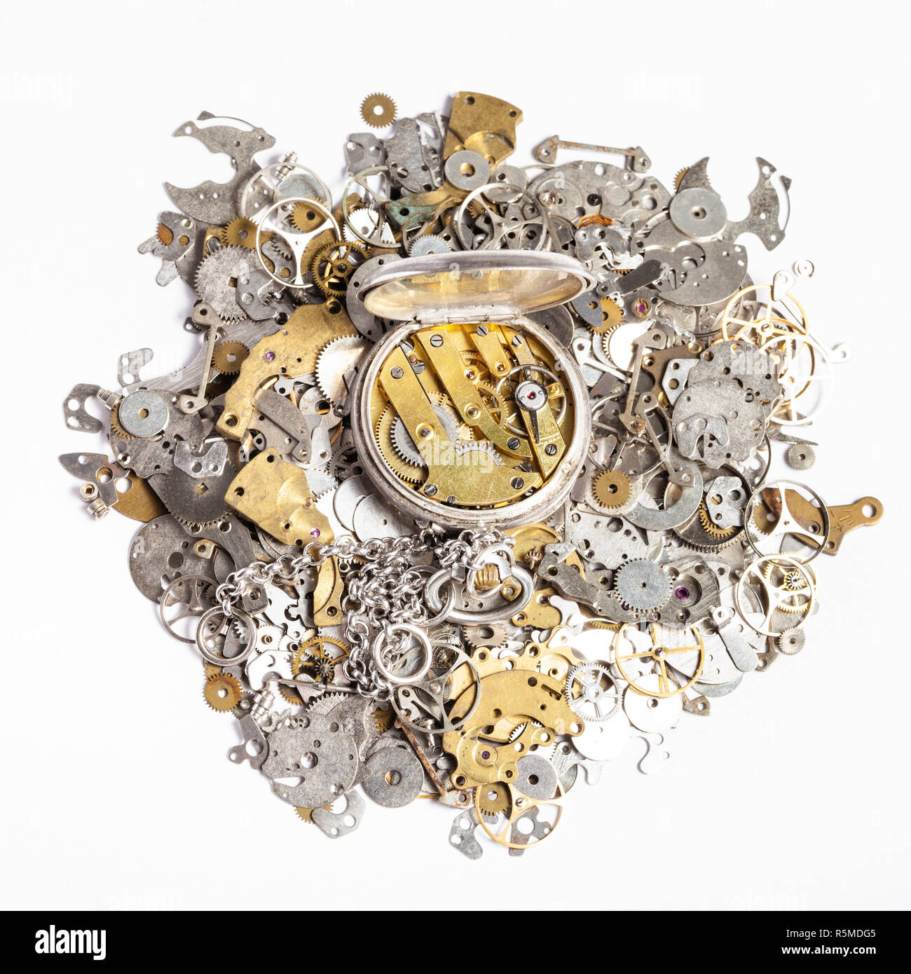 top view of pocket watch on heap of spare parts Stock Photo - Alamy
