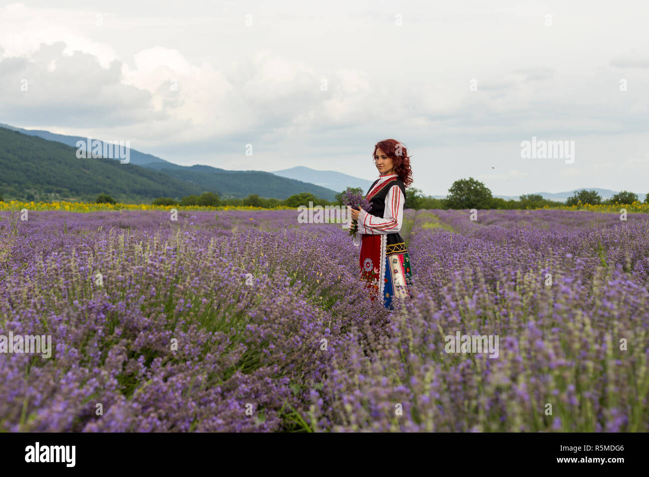 Woman dressed in traditional bulgarian dress called Nosia enjoying a ...
