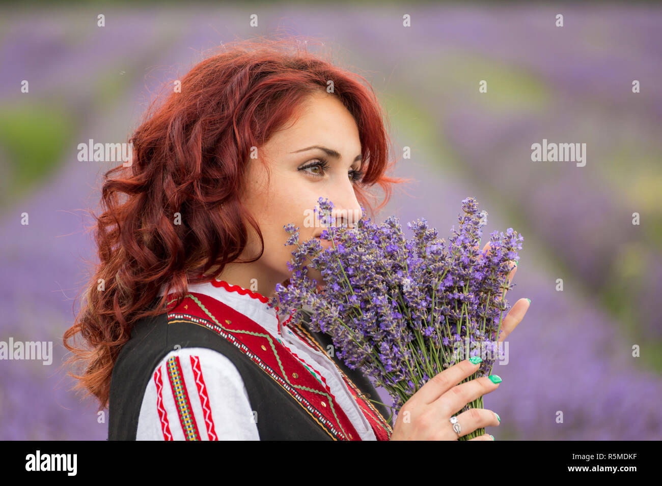 Woman dressed in traditional bulgarian dress called Nosia enjoying a ...