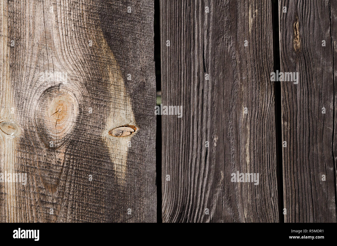 large dark wooden boards with light spots arranged vertically Stock ...