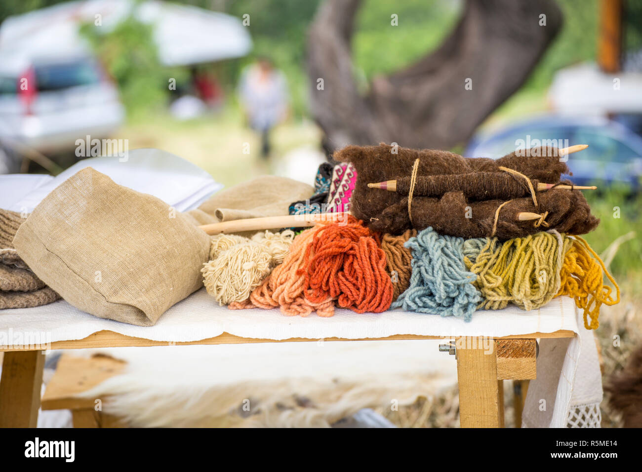 Whole table of colorful woolen threads Stock Photo - Alamy