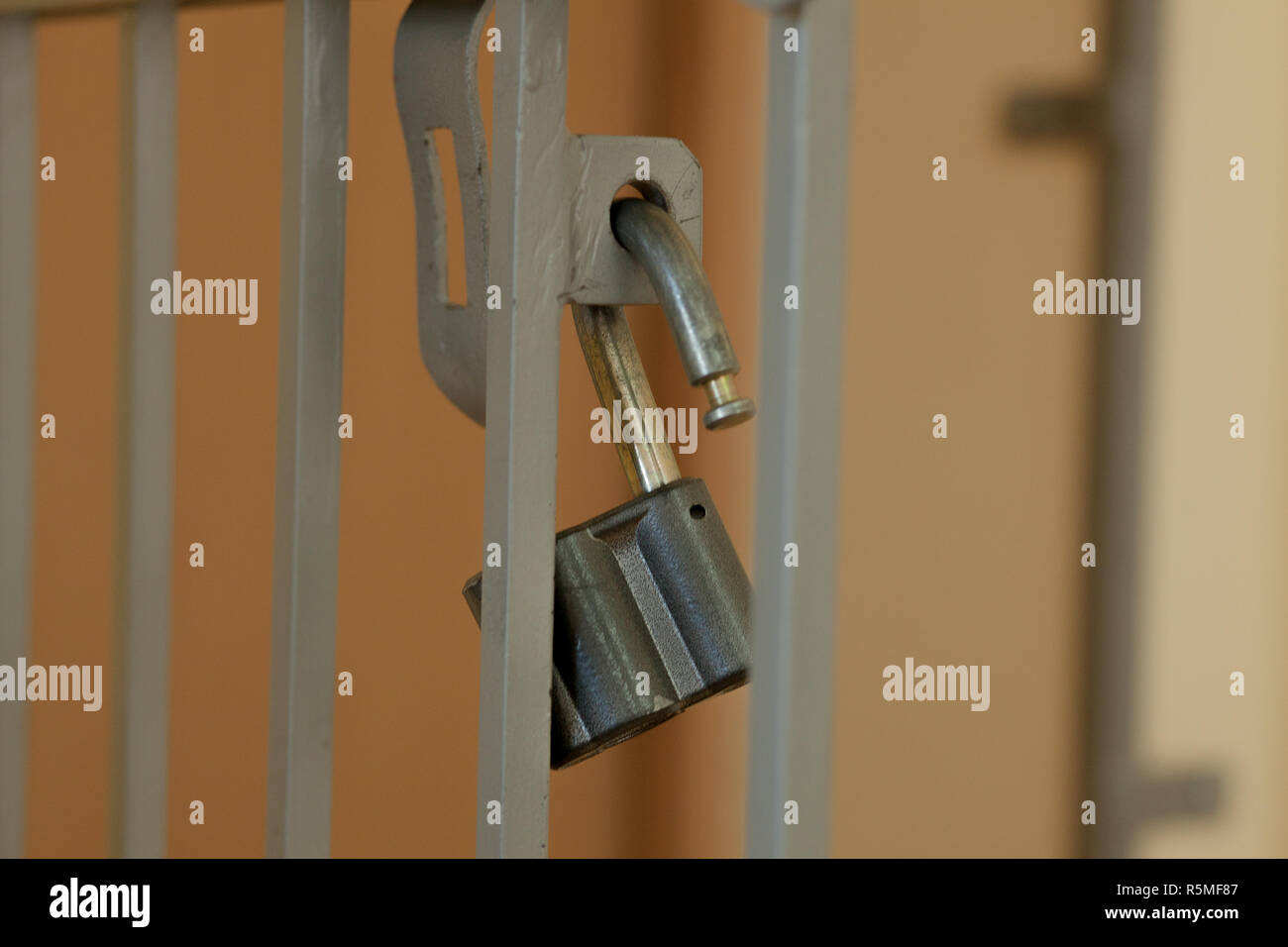 Old open padlock with old steel door Stock Photo - Alamy