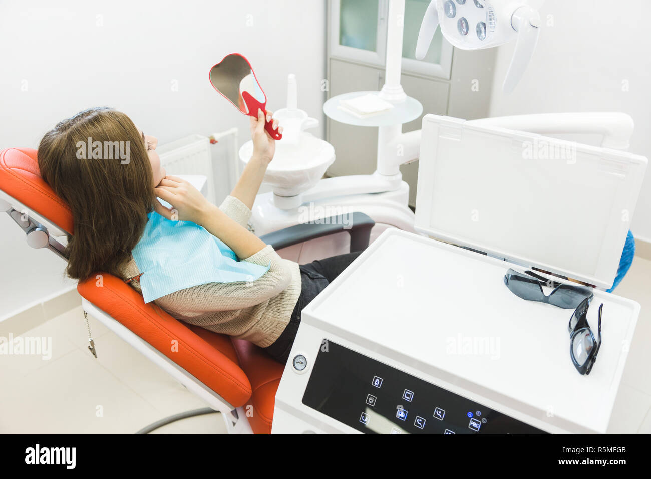 Dental clinic. Reception, examination of the patient. Teeth care. Young ...