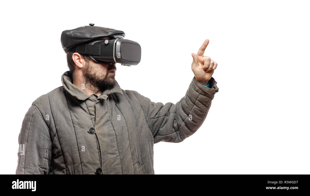 Old fashioned man immersed in virtual reality headset, studio shot ...