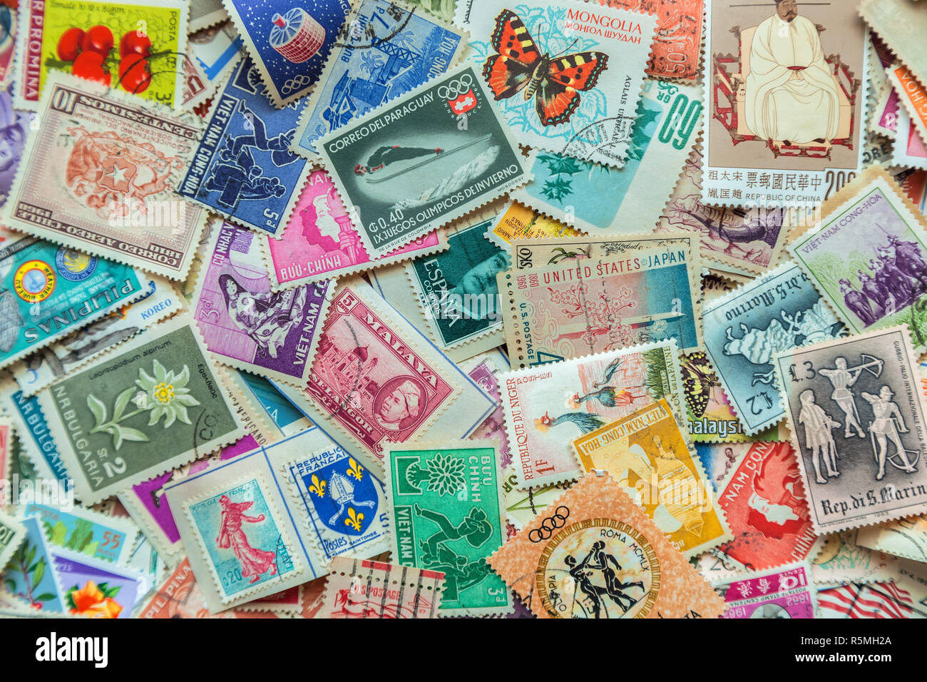 Assortment used postage stamp collecting hi-res stock photography and ...