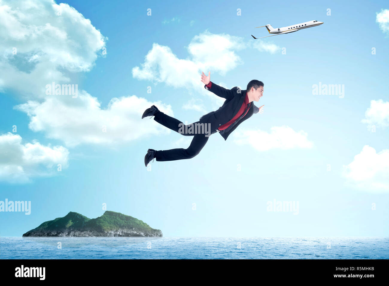 Business man jumping from airplane Stock Photo - Alamy