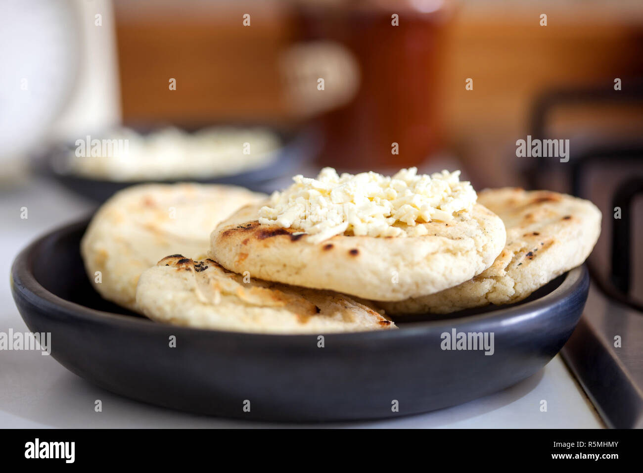 Traditional Colombian white corn arepa with cheese Stock Photo - Alamy