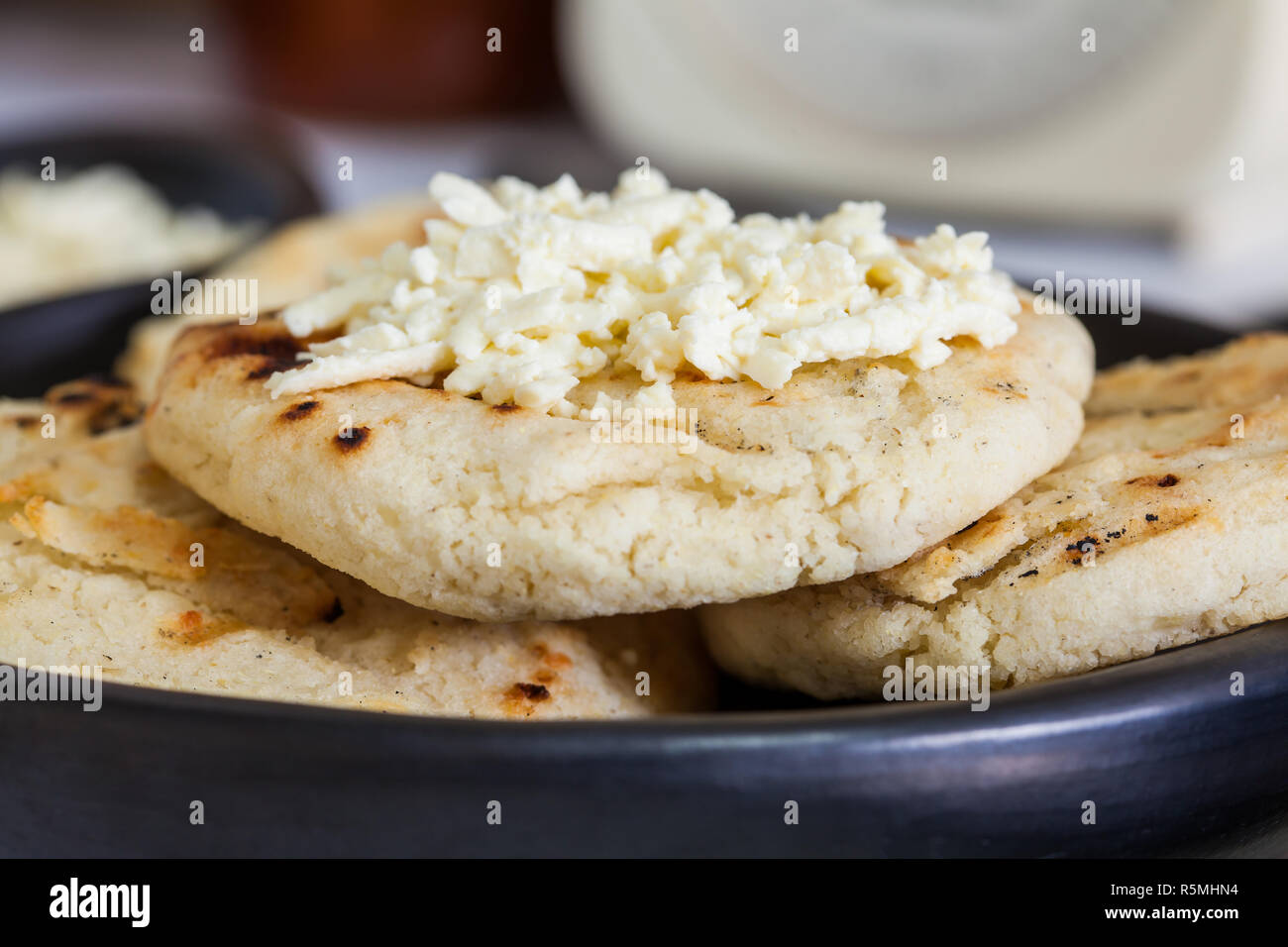 Traditional Colombian white corn arepa with cheese Stock Photo - Alamy