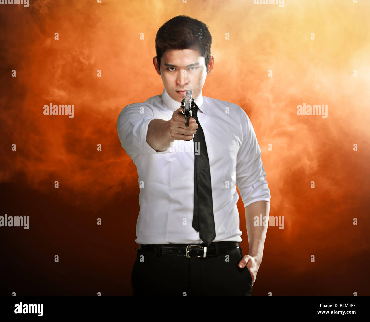 Secret Agent Holding Gun Stock Photo - Alamy