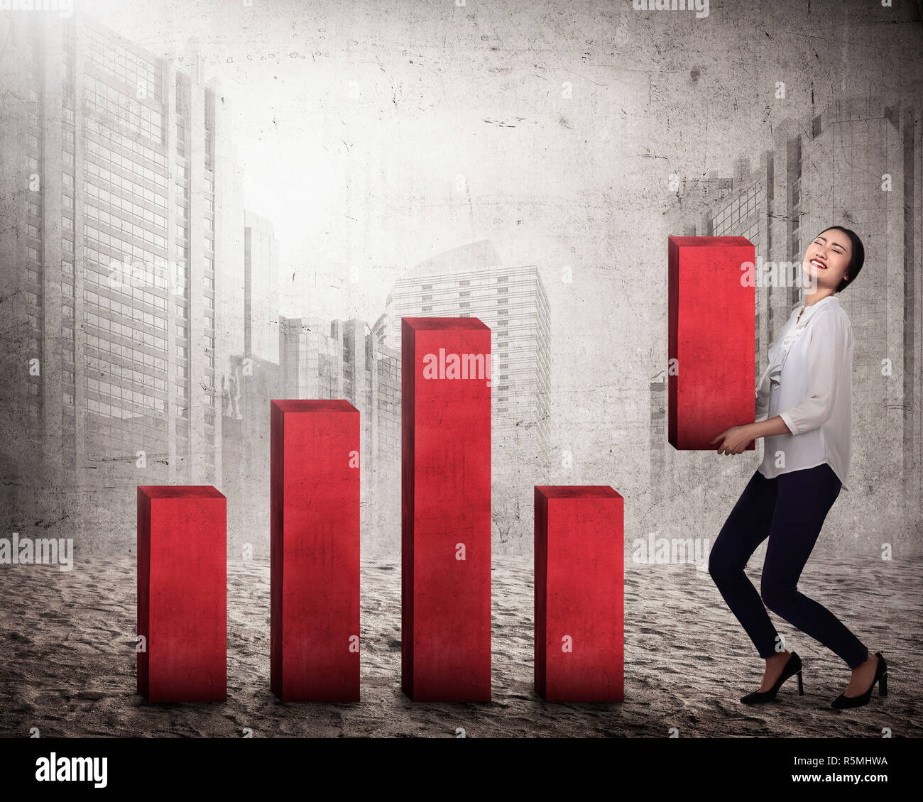 Asian business woman lifting block of chart Stock Photo - Alamy