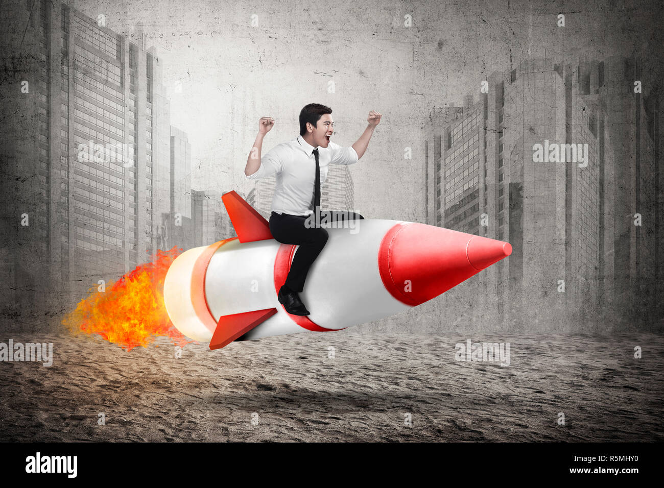 Asian business man riding rocket Stock Photo - Alamy