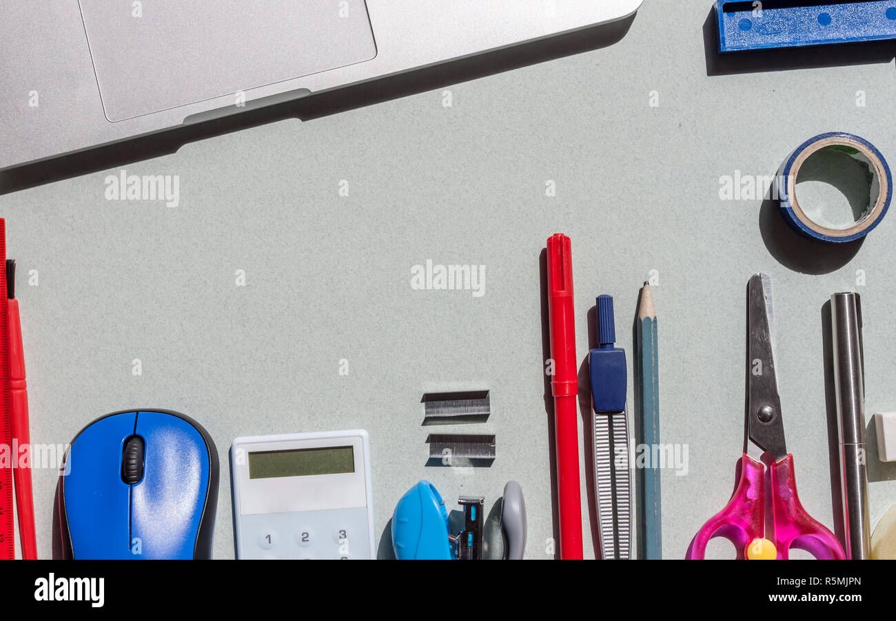 school stationery on blue paper background Stock Photo - Alamy