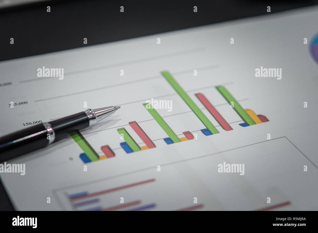 Graph line on the desk Stock Photo - Alamy