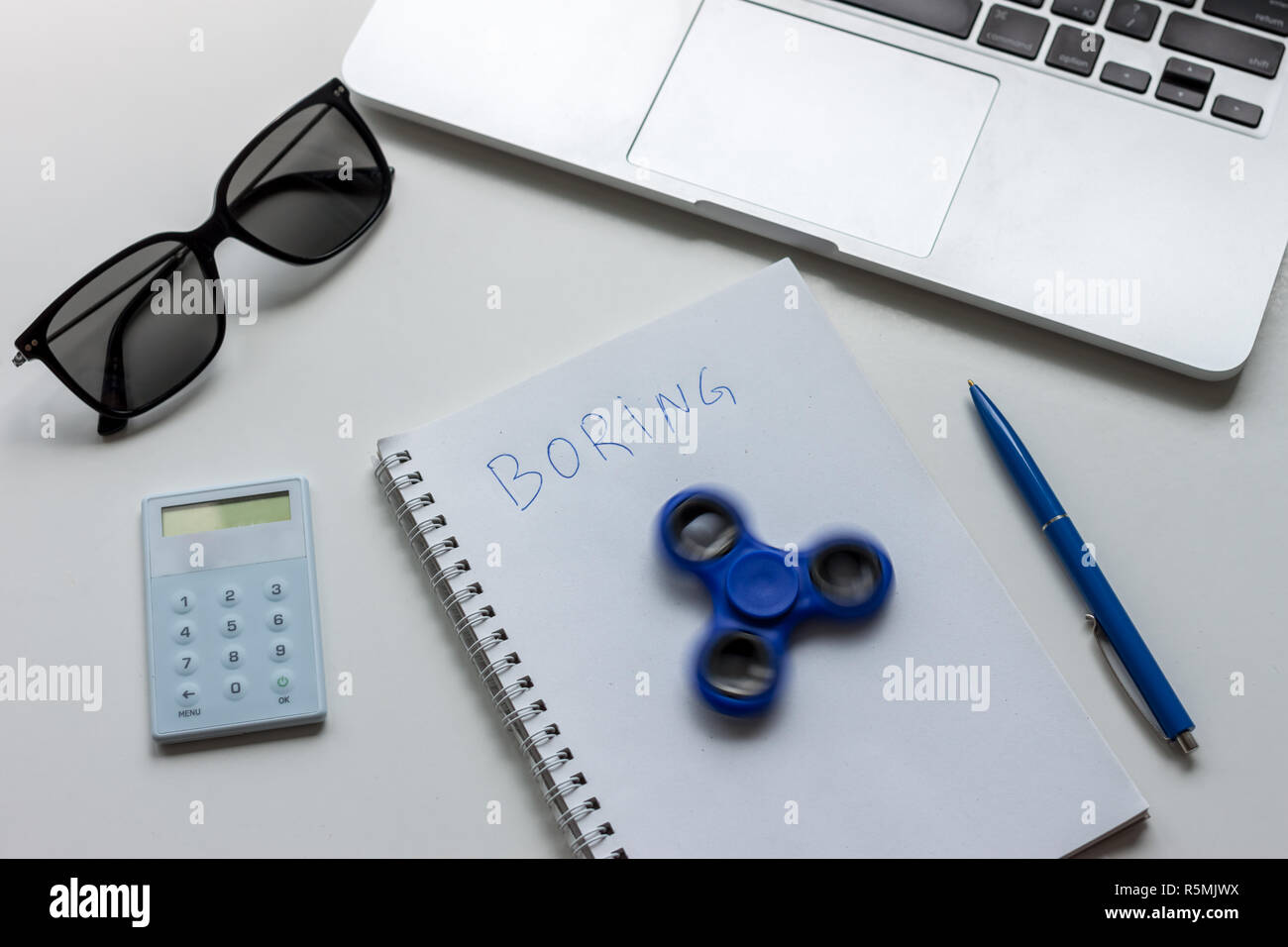 work desk with laptop notebook and spinner Stock Photo - Alamy