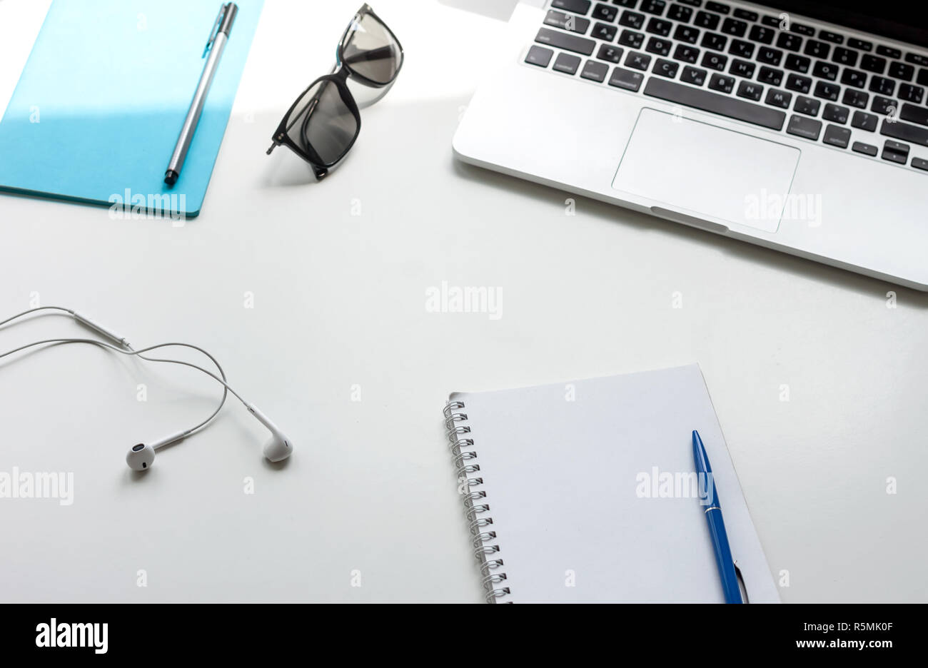 work desk with laptop and notebook Stock Photo - Alamy