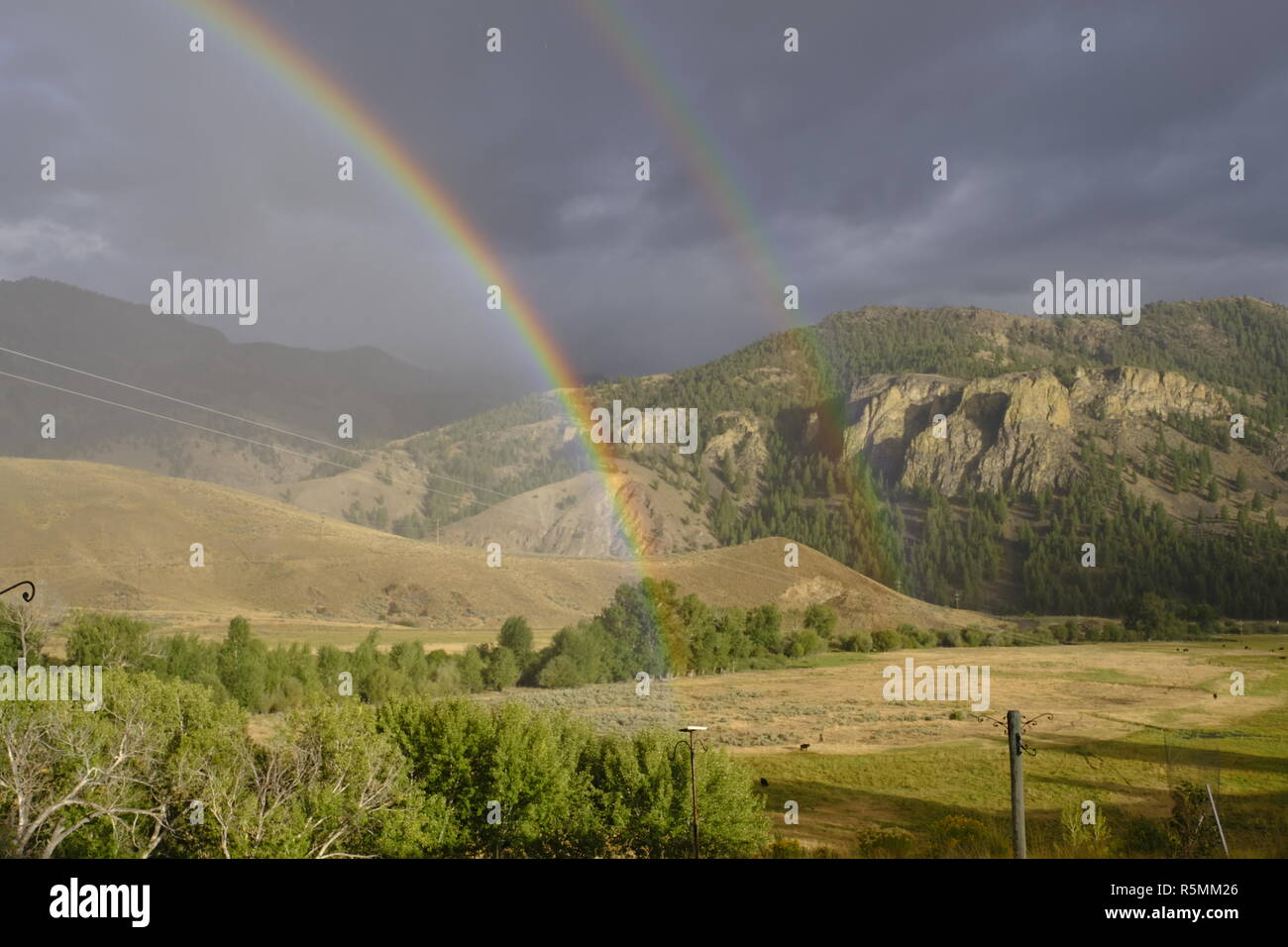 Rainbow and double rainbow over the mountains in central Idaho Stock ...