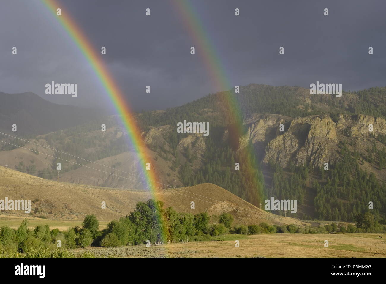 Rainbow and double rainbow over the mountains in central Idaho Stock ...