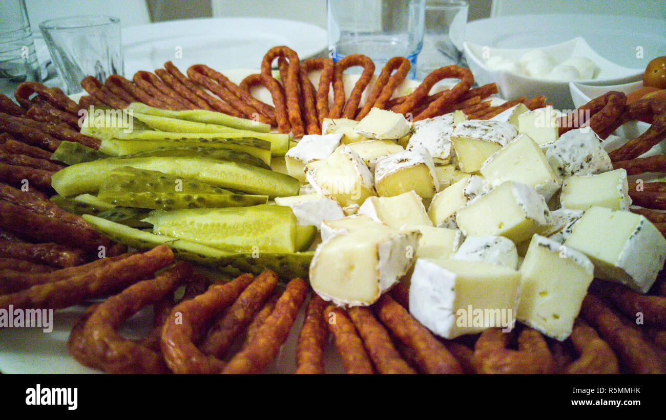Big platter of sliced pickles, hermelin cheese and kabanos - sausage ...