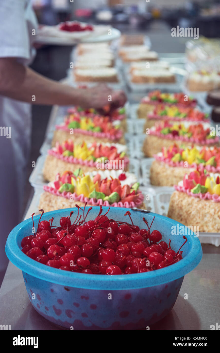 Cake production confectionery factory workers hi-res stock photography ...