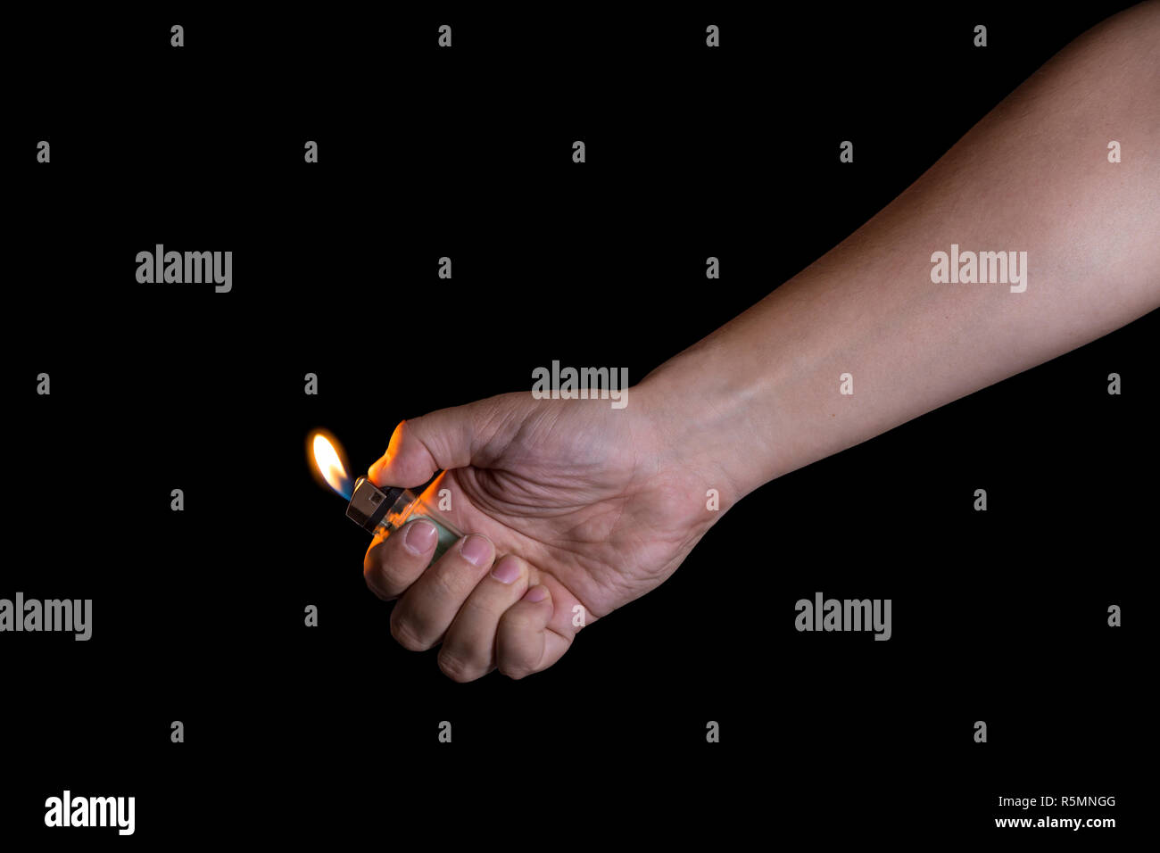 Human hand holding a lighter isolated on black background Stock Photo ...