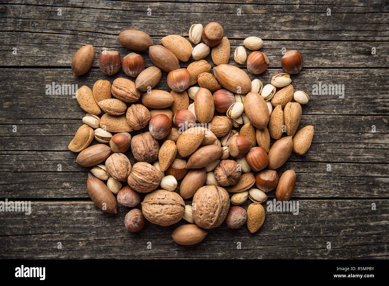 Different types of nuts in the nutshell Stock Photo - Alamy