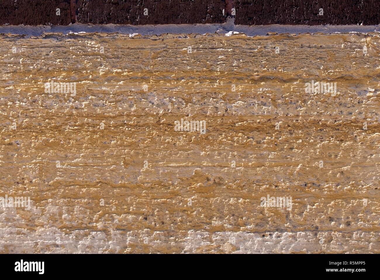 Old limestone block as part of a building foundation Stock Photo - Alamy