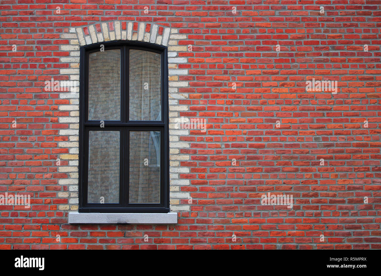 red brick wall window curtain home building Stock Photo - Alamy