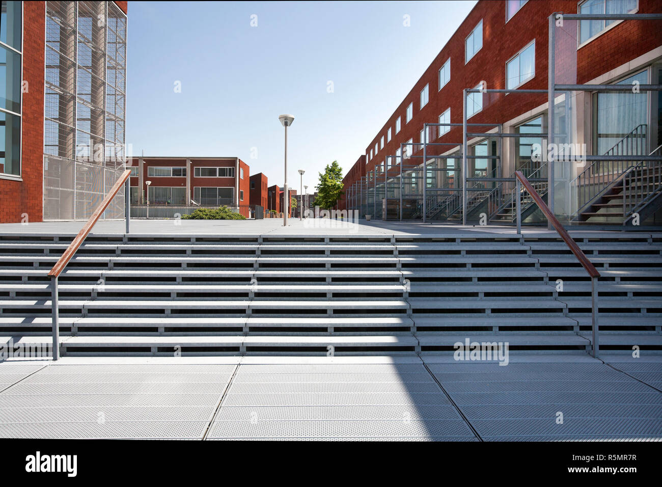 Modern neighborhood with metal pavement Stock Photo - Alamy