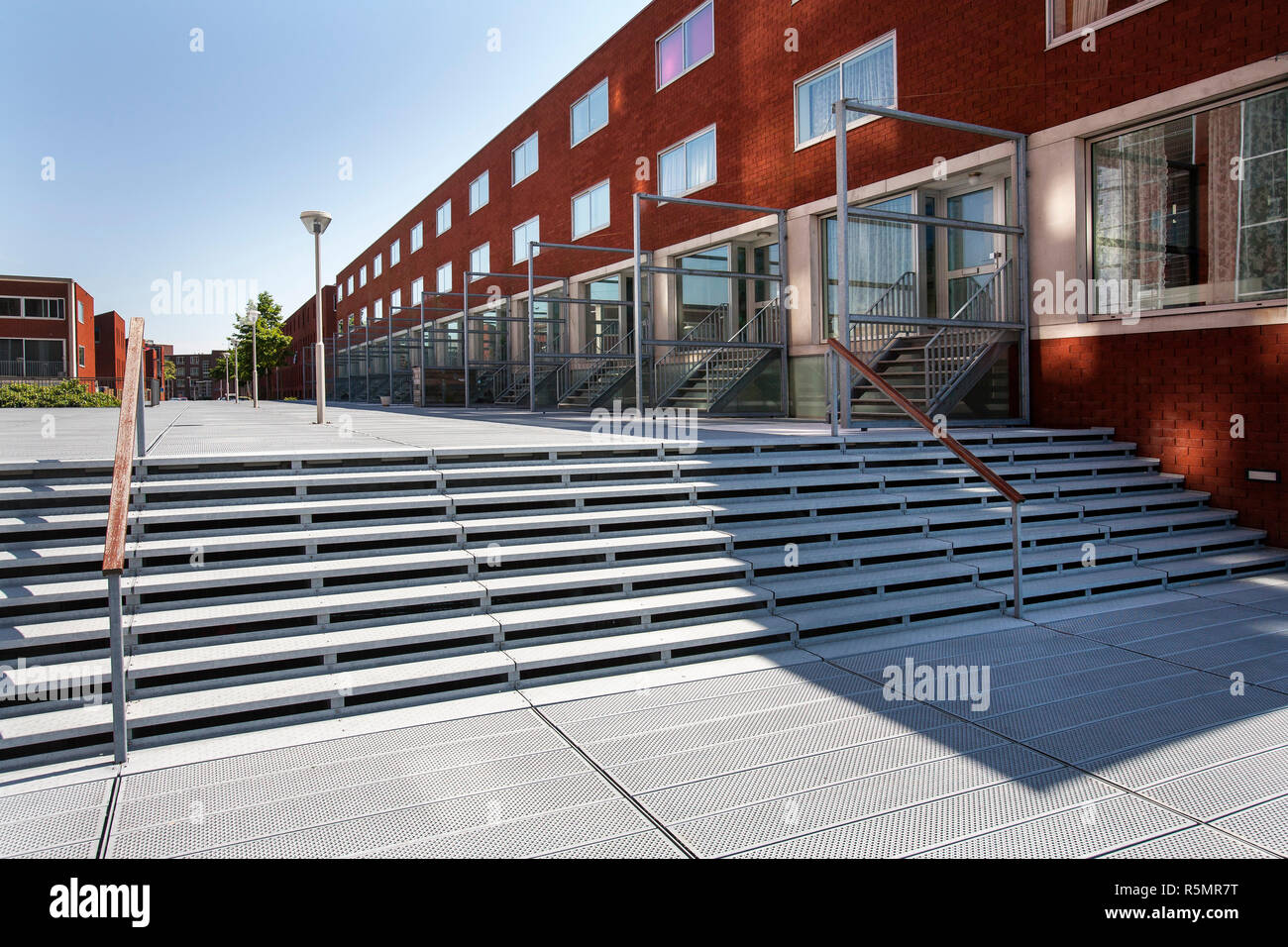 Modern neighborhood with metal pavement Stock Photo - Alamy