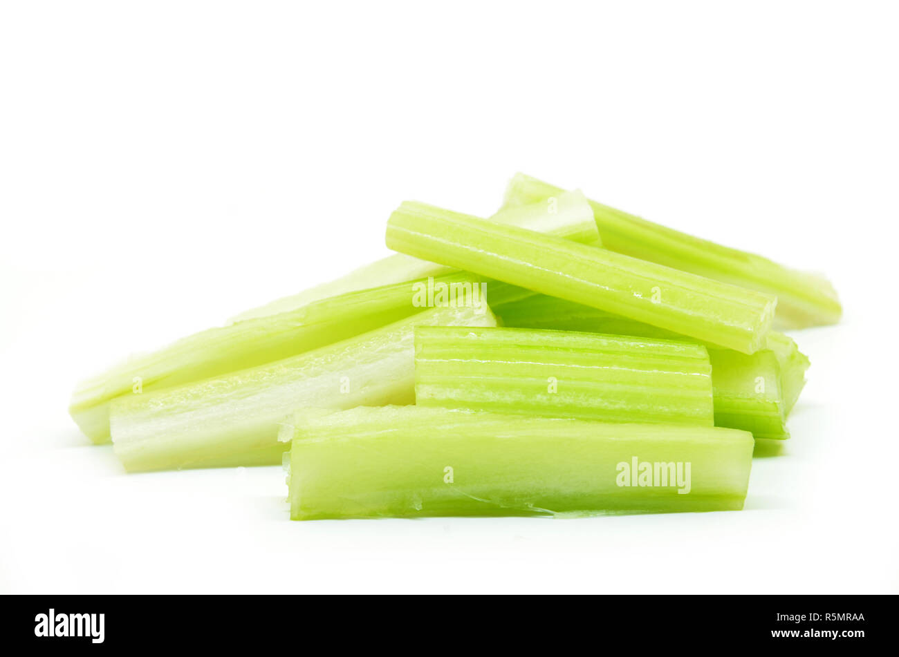 Cutting fresh bunch of celery Stock Photo - Alamy