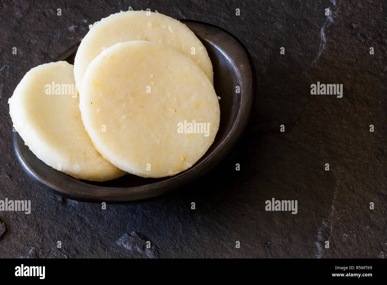 Raw traditional Colombian white corn arepa Stock Photo - Alamy