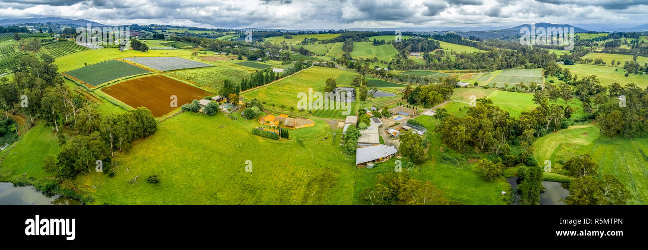Wide aerial panorama of fields, meadows, and pastures - rolling ...