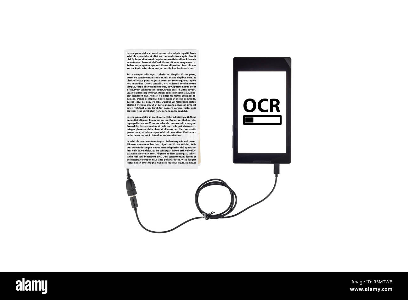 Book connected to a tablet through an USB cable. Optical character ...