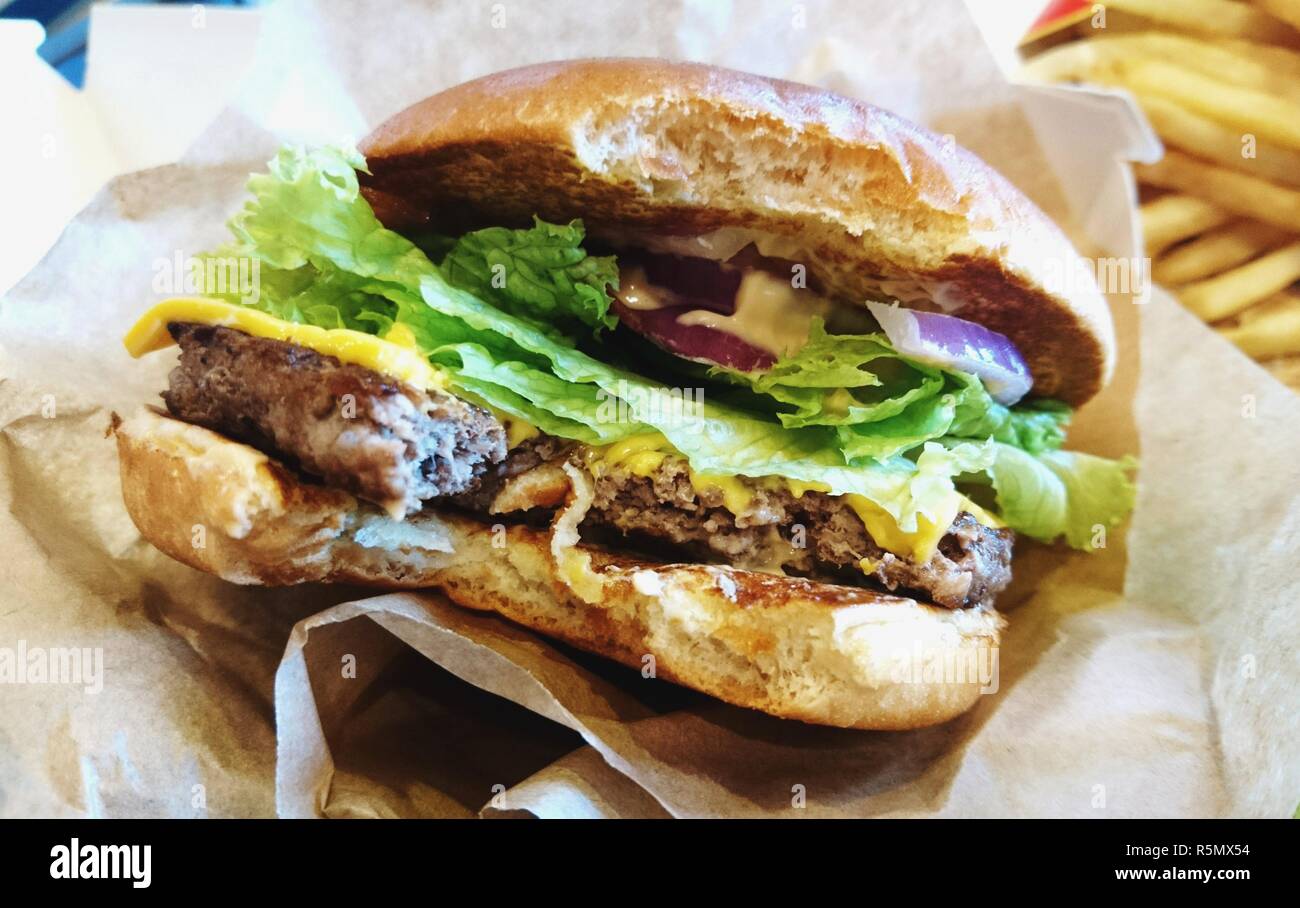 Cheeseburger with missing bite hi-res stock photography and images - Alamy