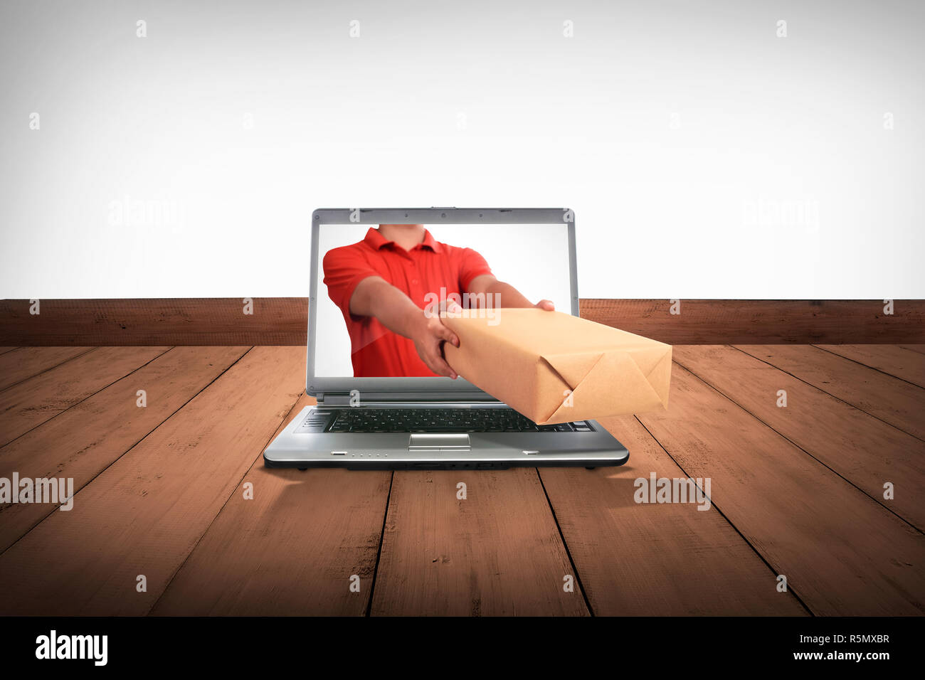 Hand giving a box out of laptop screen Stock Photo - Alamy