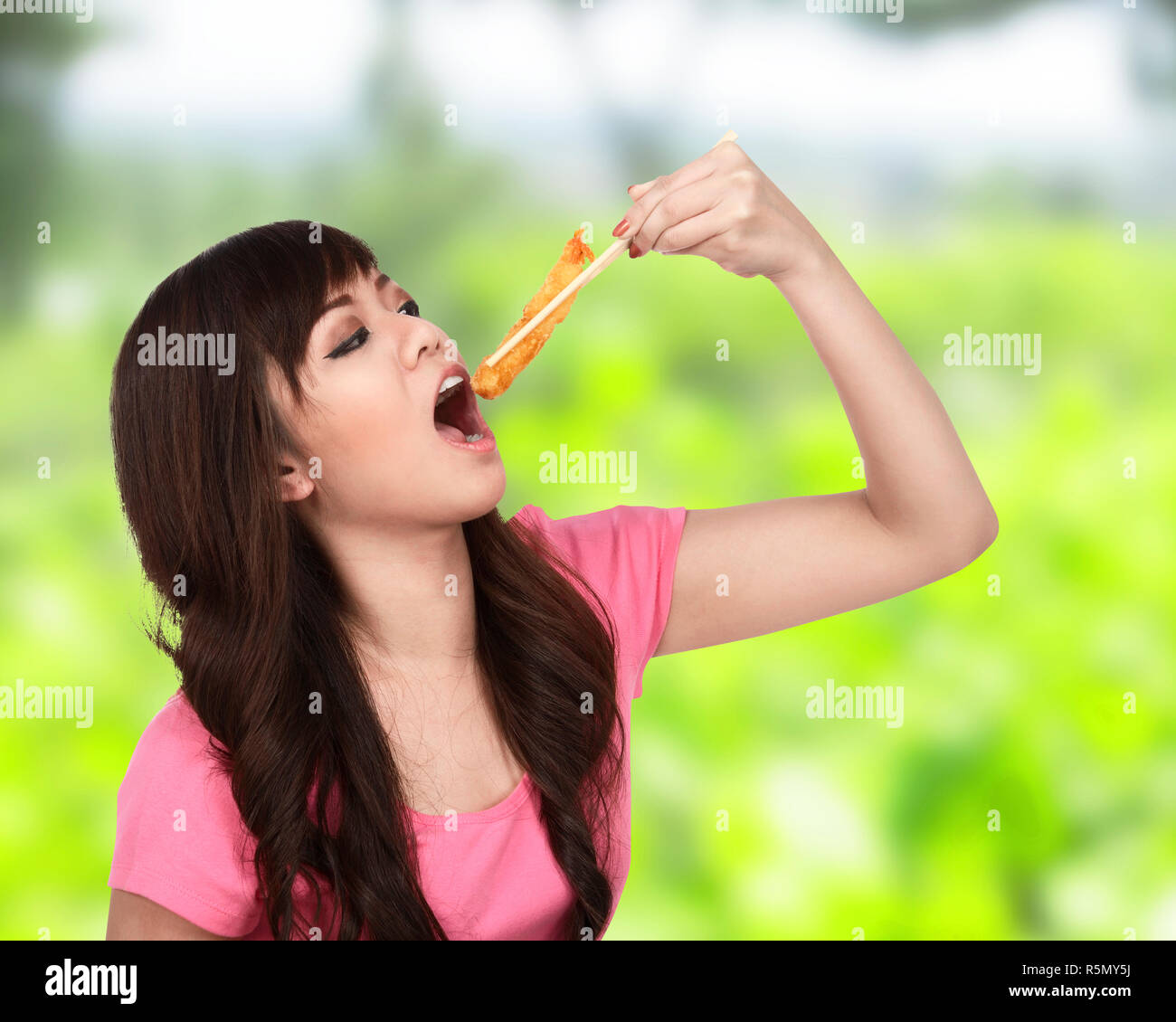 Pretty smiling girl eats hi-res stock photography and images - Alamy