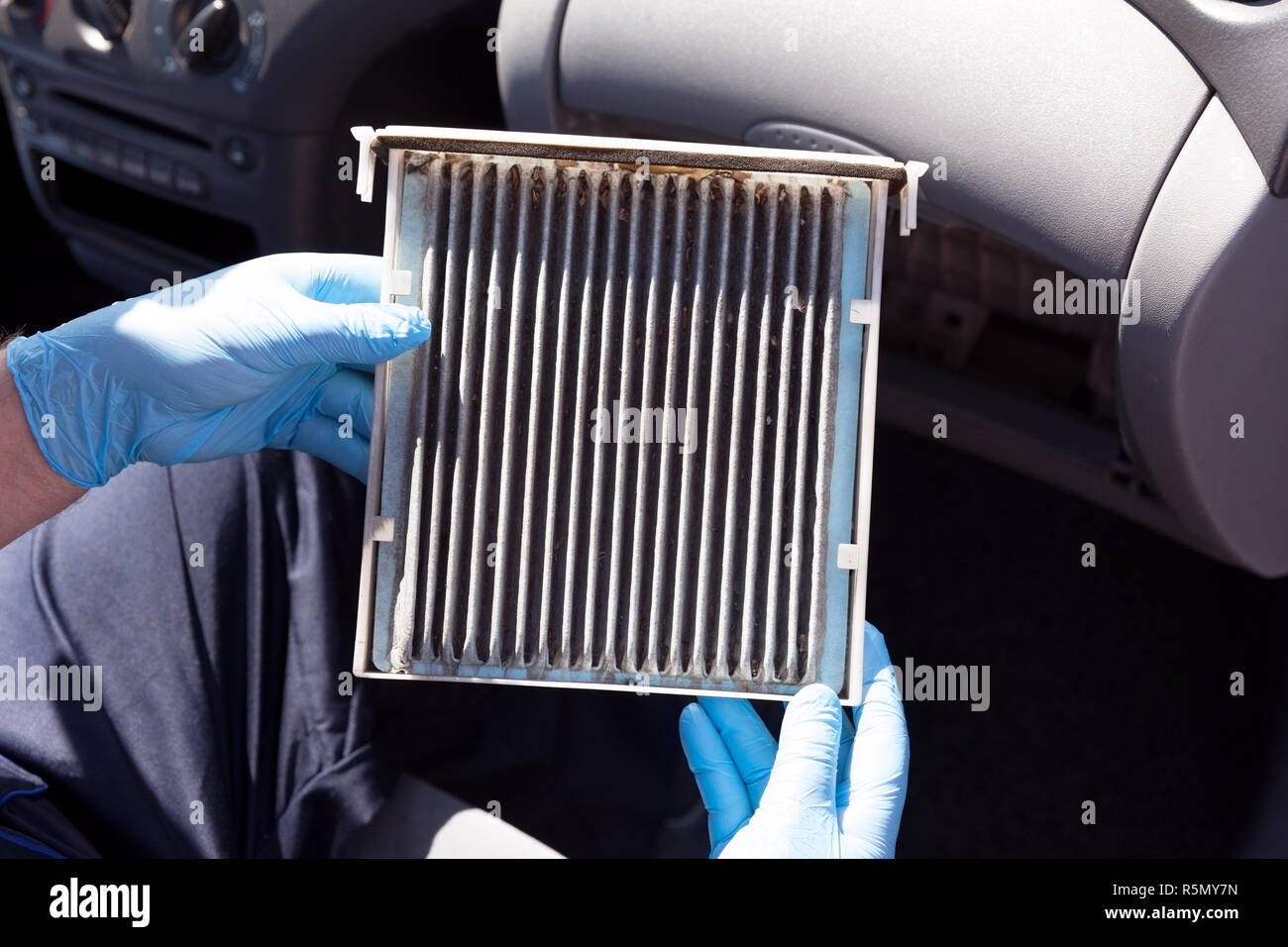 Replacing the old cabin air filter Stock Photo - Alamy