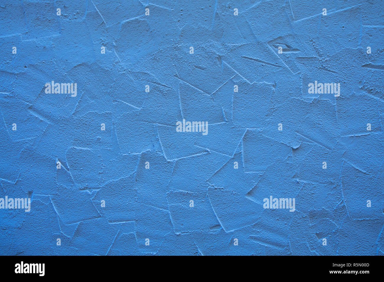 Blue wall of embossed decorative plaster Stock Photo - Alamy