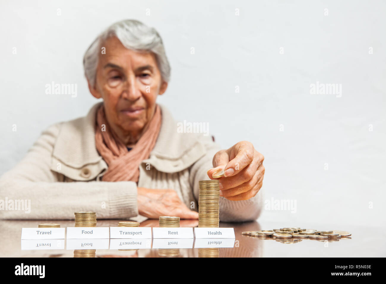 Senior woman budget with big expenses on health Stock Photo - Alamy