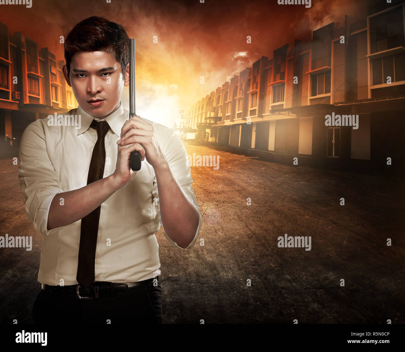 Secret Agent Holding Gun Stock Photo - Alamy