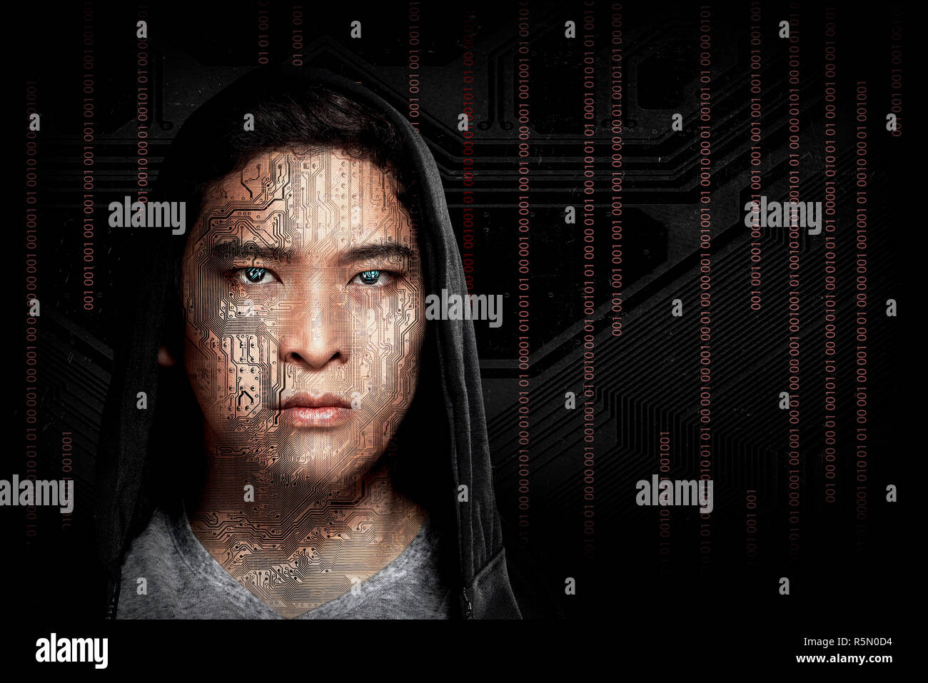 Hacker wearing hoodie shirt Stock Photo - Alamy