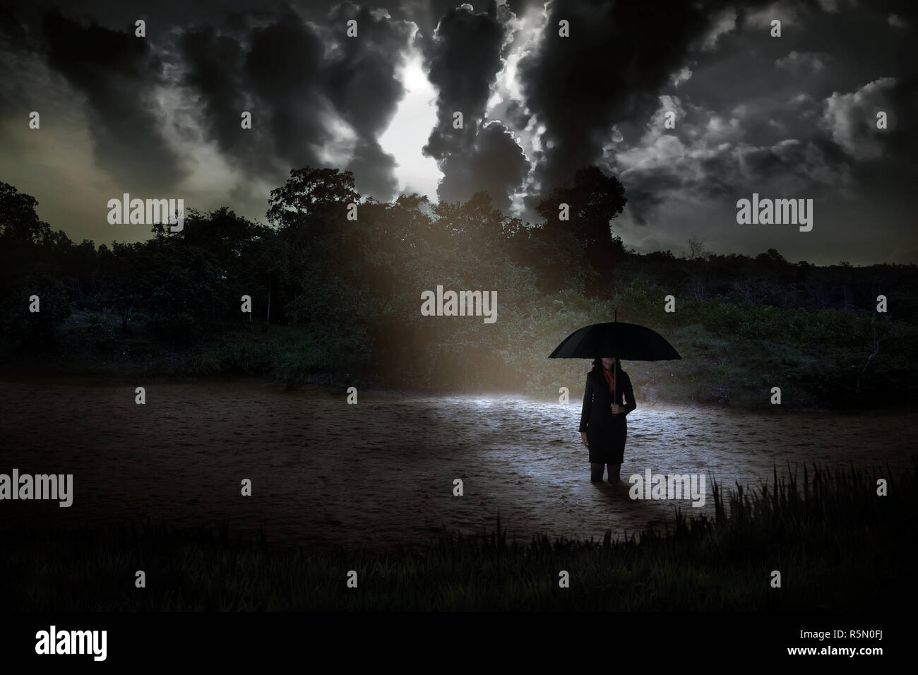 Woman standing on creepy lake hi-res stock photography and images - Alamy