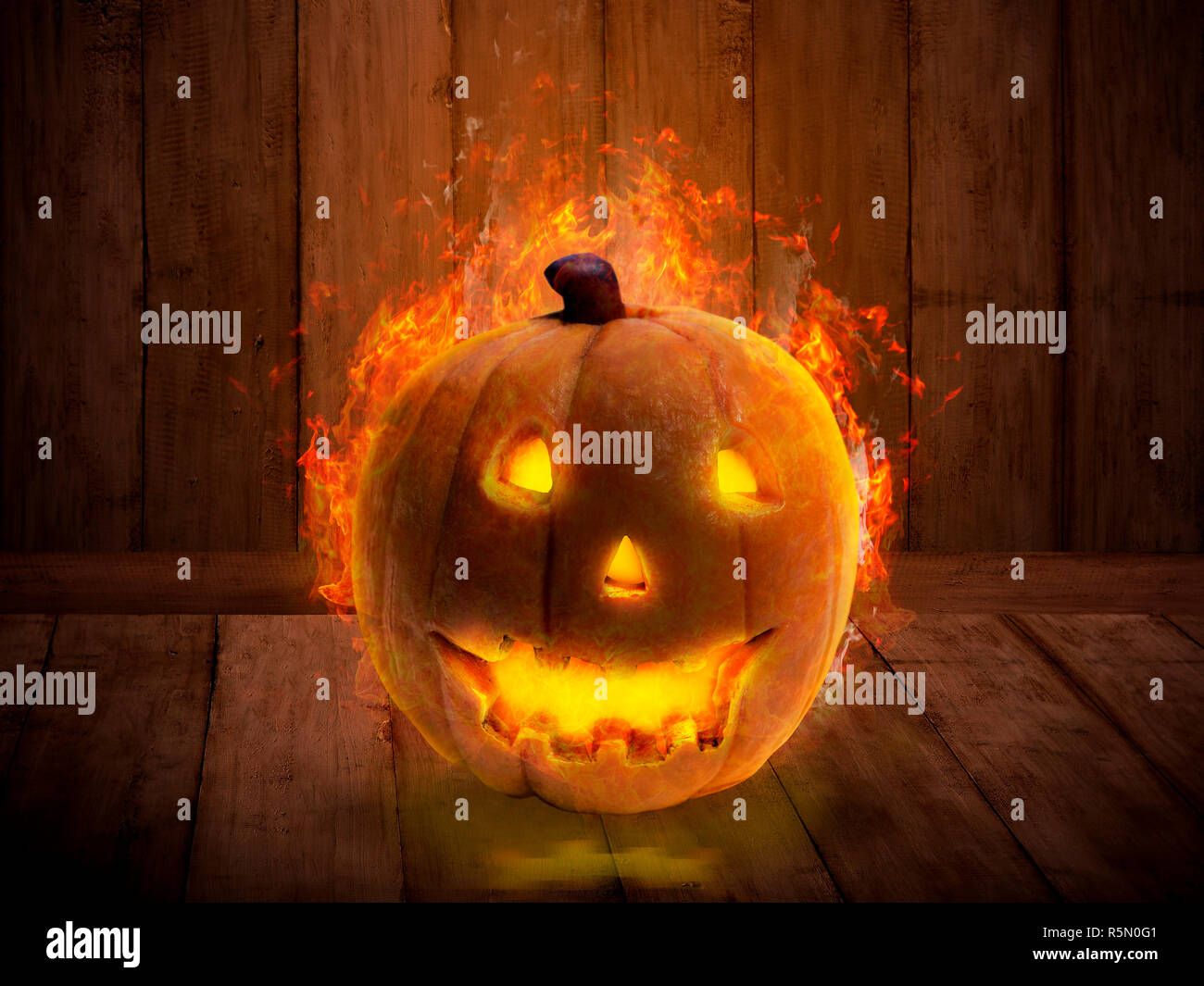 Scary Jack O Lantern with candle inside on the wooden floor Stock Photo ...