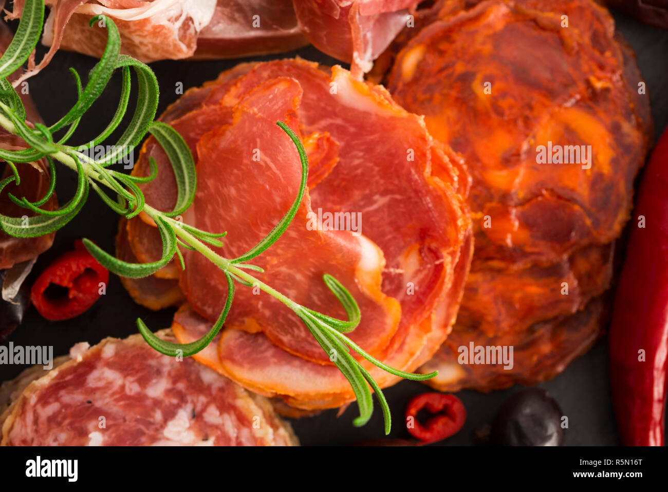 a pile of different spanish embutido,jamon,chorizo u200bu200band lomo ...