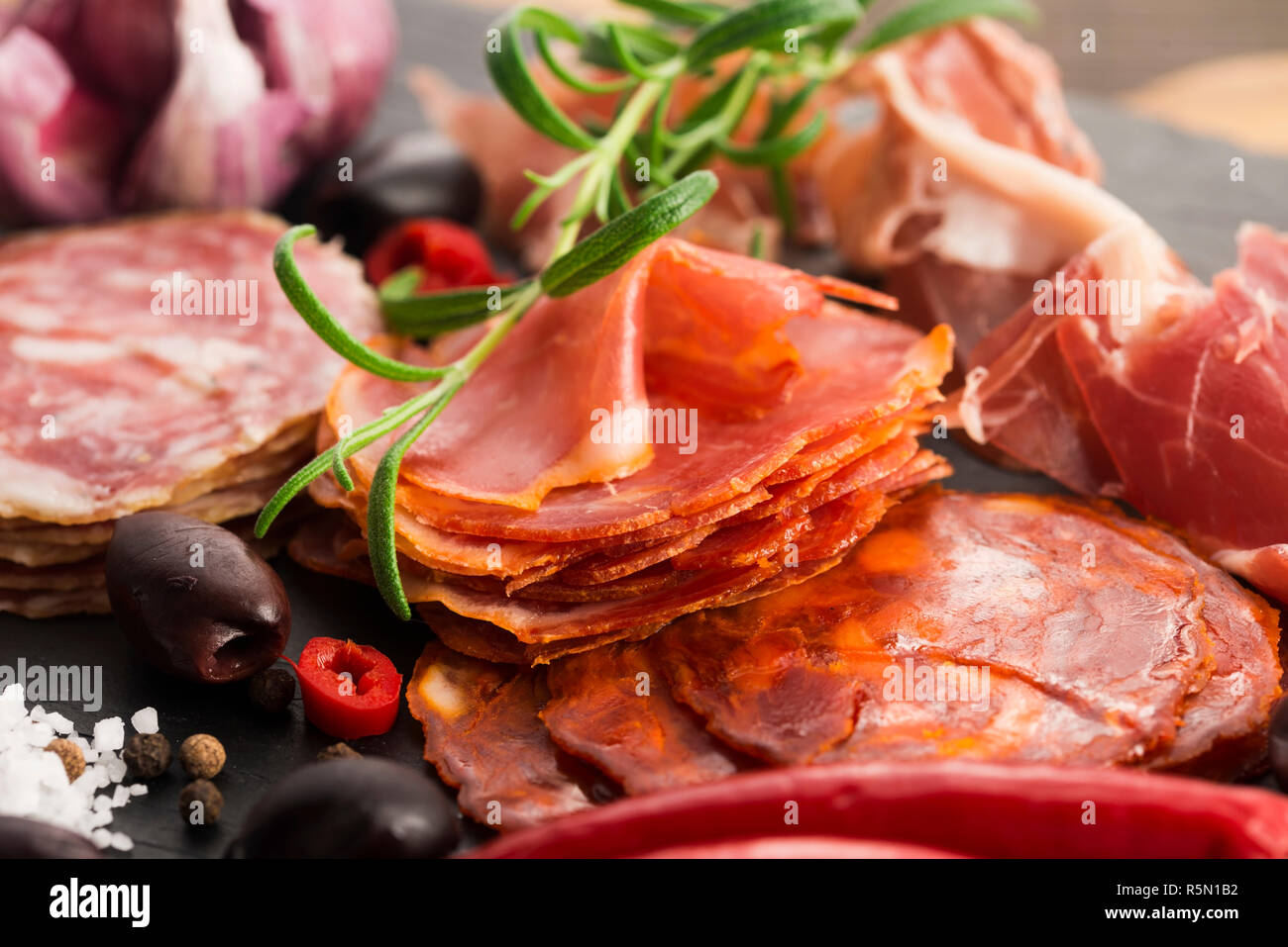a pile of different spanish embutido,jamon,chorizo u200bu200band lomo ...