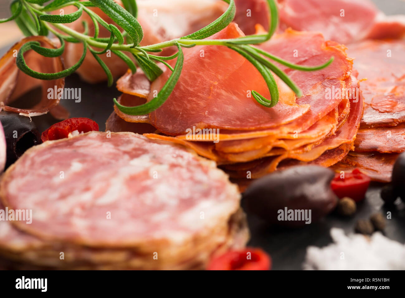 a pile of different spanish embutido,jamon,chorizo u200bu200band lomo ...