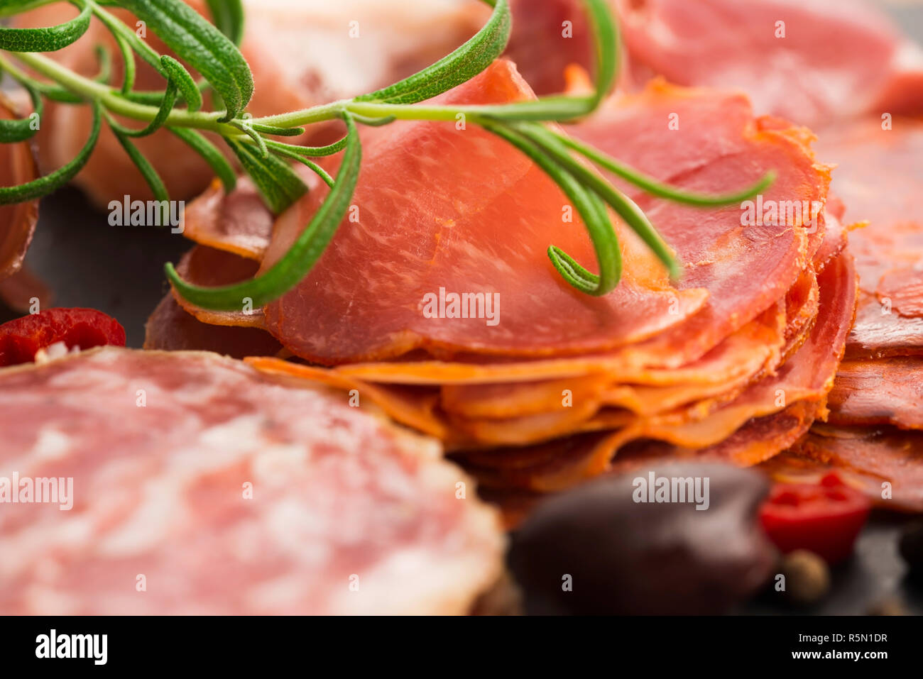 a pile of different spanish embutido,jamon,chorizo u200bu200band lomo ...
