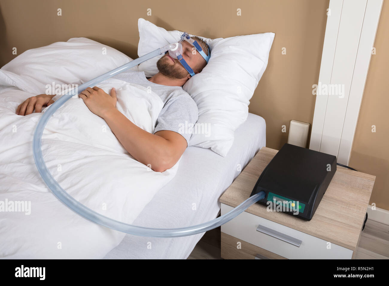 Sleeping with cpap machine hi-res stock photography and images - Alamy