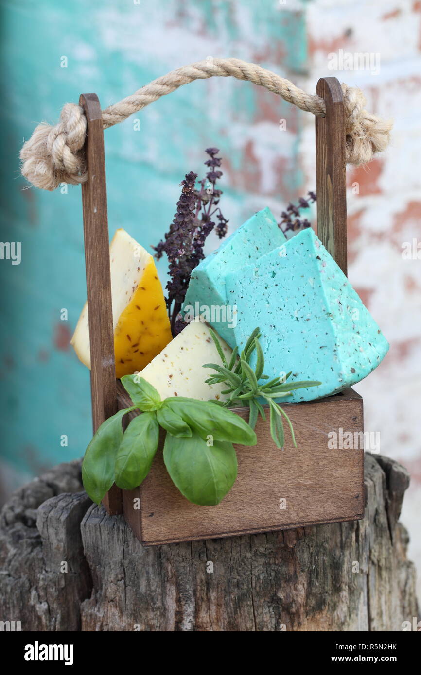 Craft cheeses in a wooden decorative box Stock Photo - Alamy